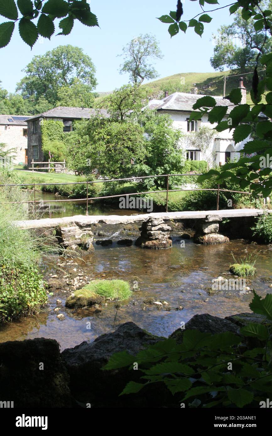 Ancient river crossing a clapper bridge, Malham, Yorkshire, England UK ...
