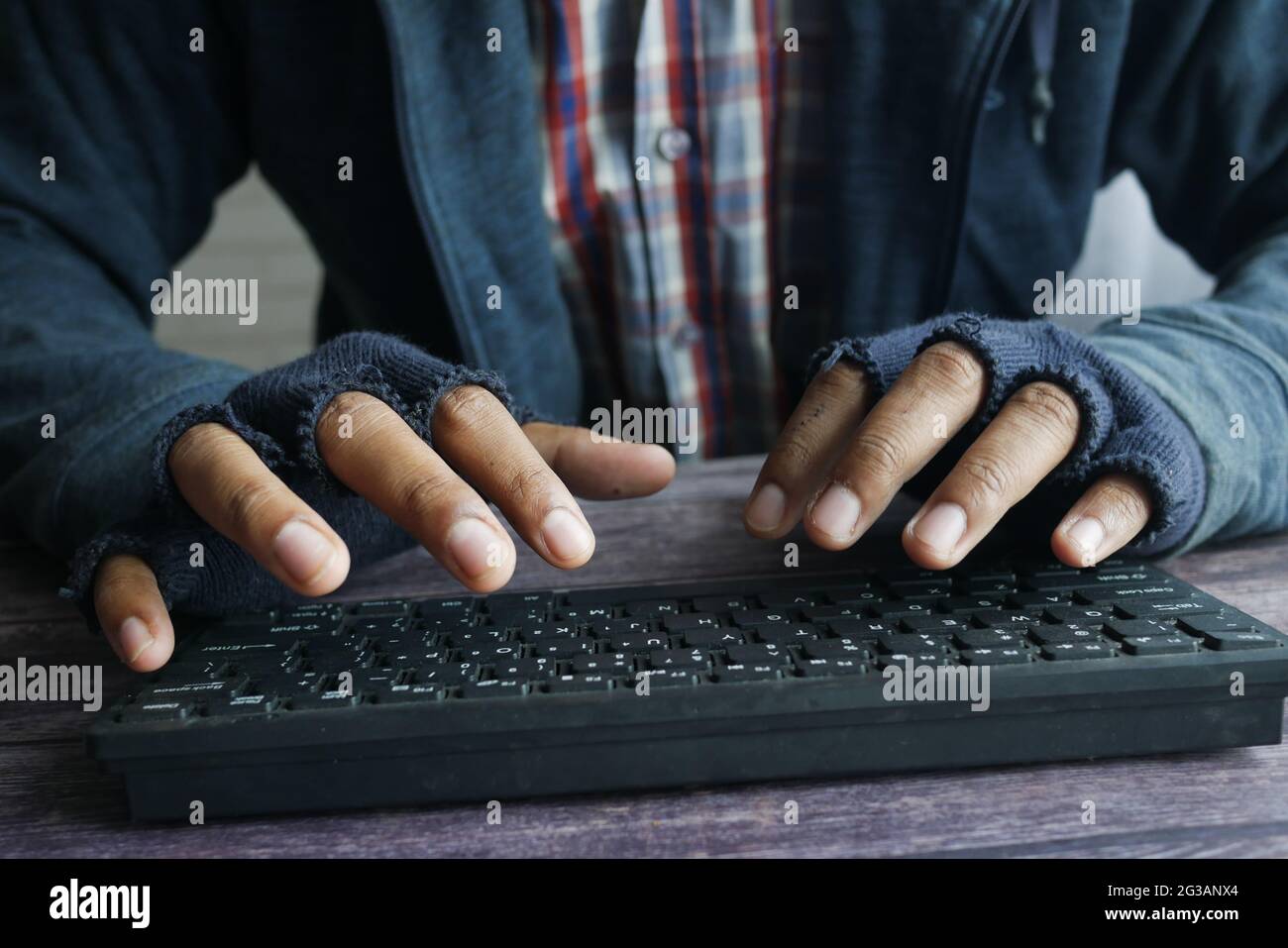 hacker hand stealing data from laptop top down Stock Photo - Alamy
