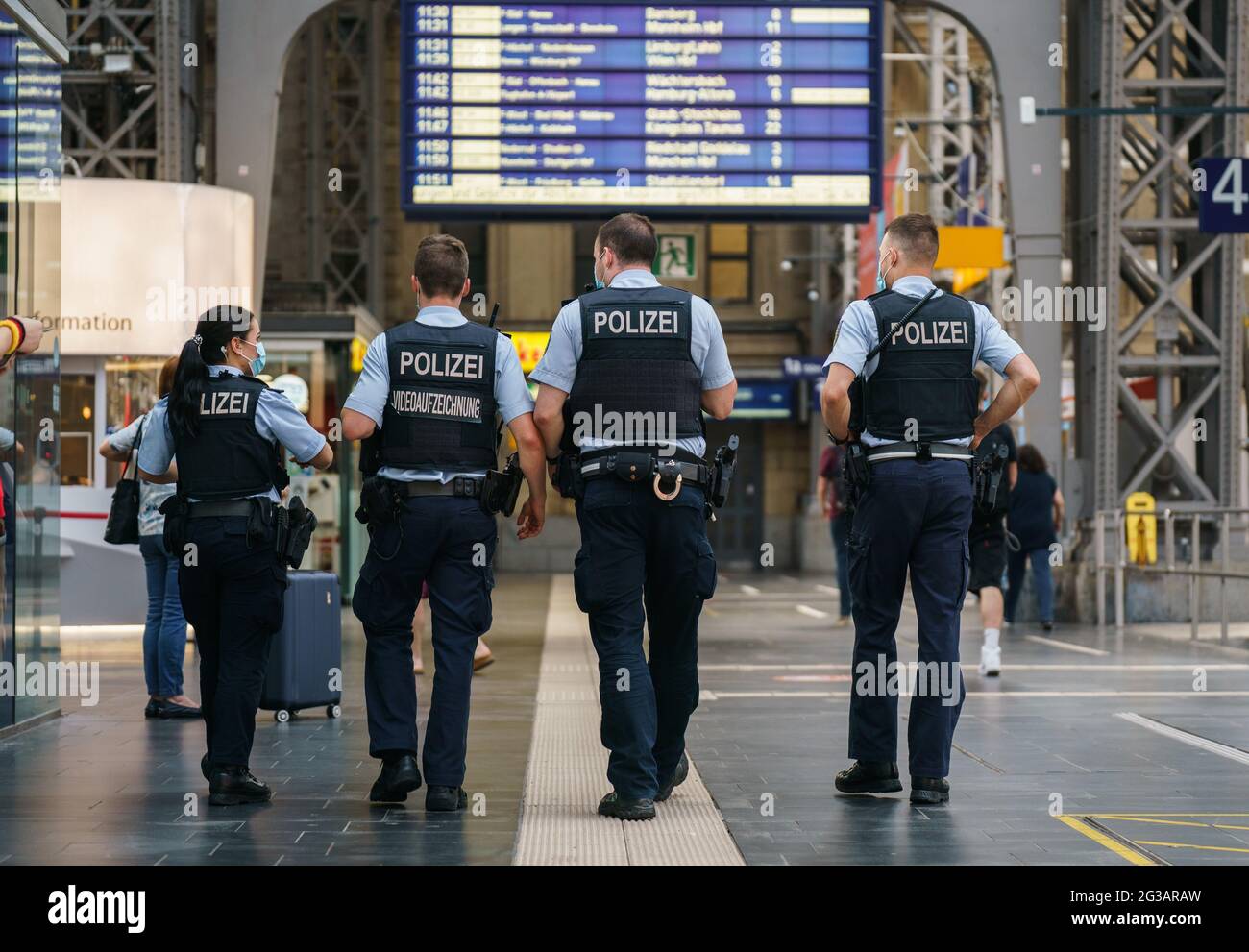 15 June 2021, Hessen, Frankfurt/Main: Police officers walk through the ...