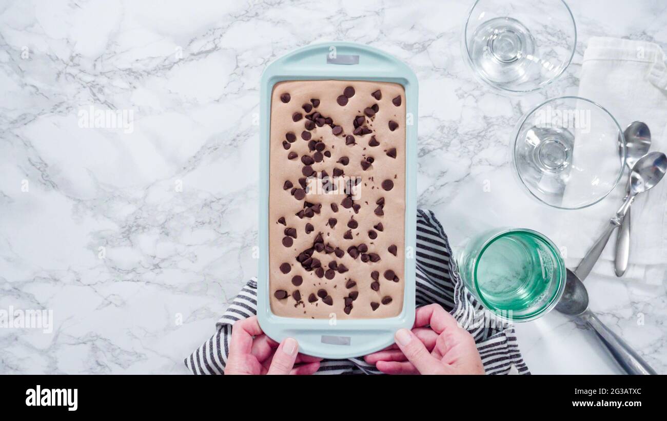 Flat lay. Homemade chocolate ice cream in a baking pan Stock Photo - Alamy