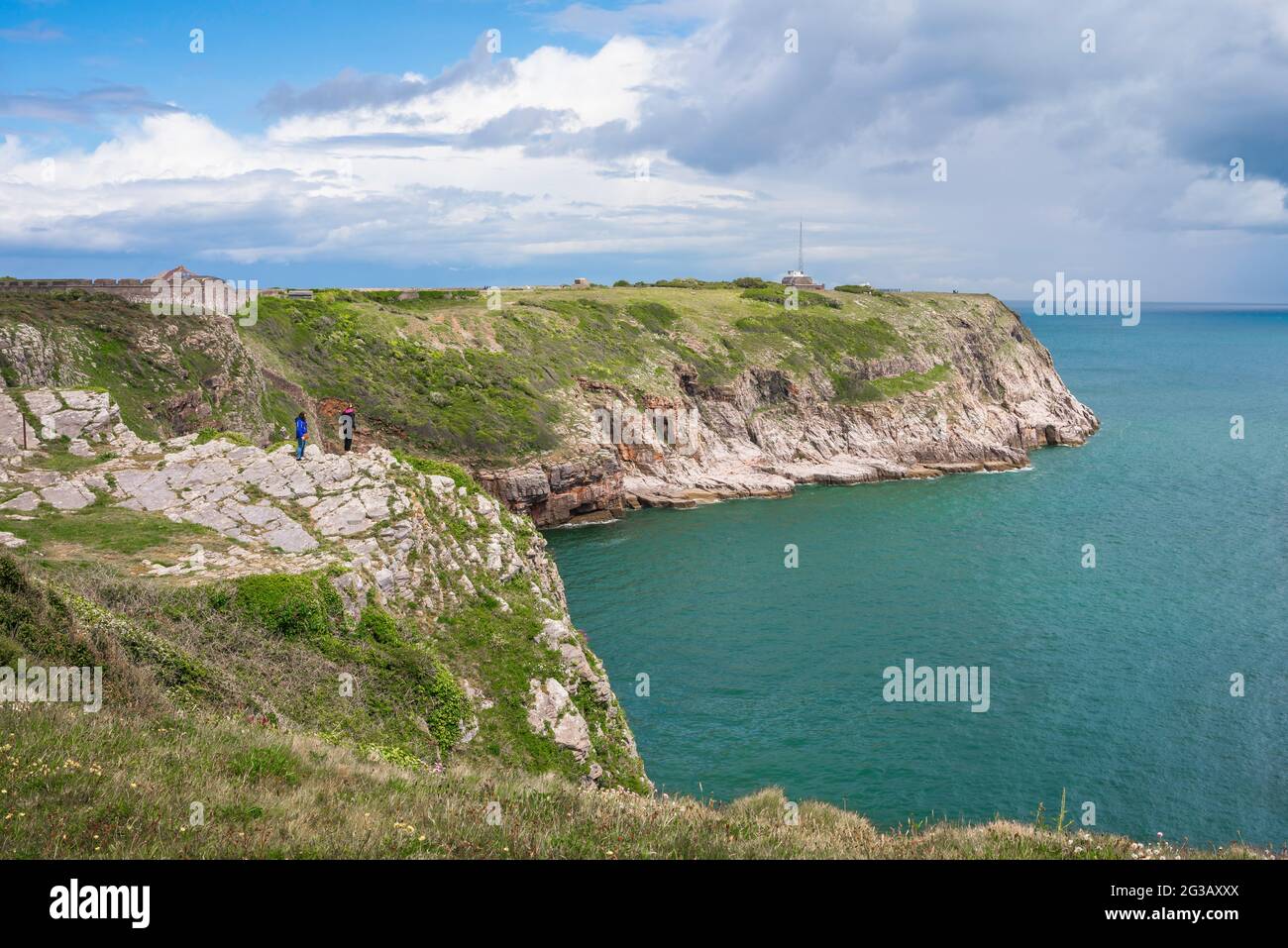 Berry Head Devon coast, view of two women looking towards the Berry ...