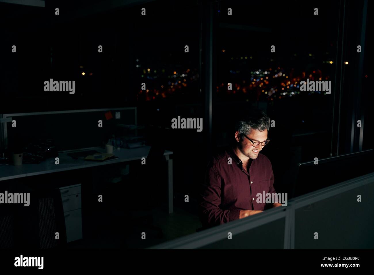 Person on computer at night hi-res stock photography and images - Alamy