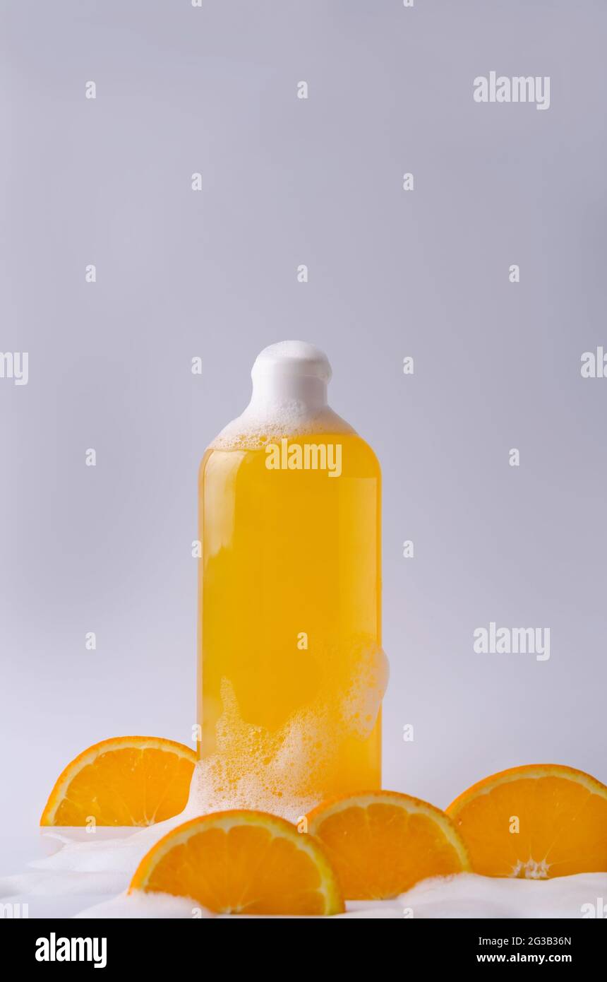 Shampoo, shower gel, orange liquid soap with natural ingredients in a ...