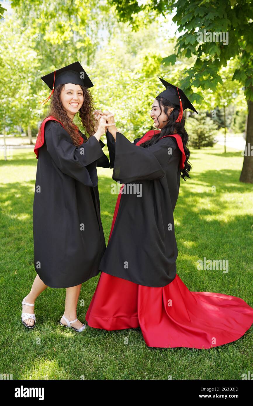 successful happy graduating student with nature green background near ...