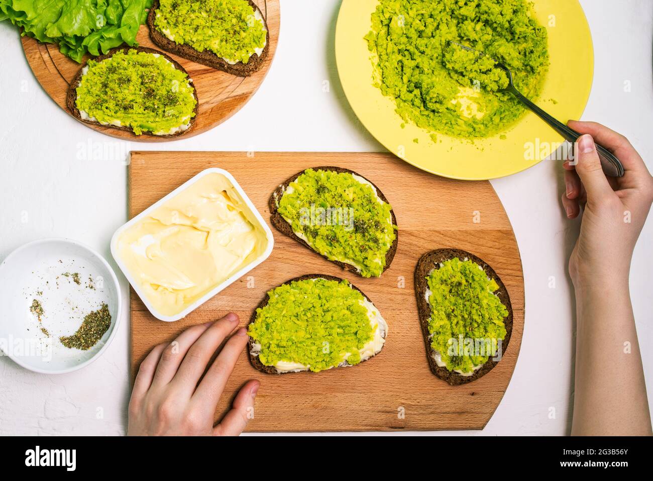 Appetizing appetizer with avocado. The process of making sandwiches for ...