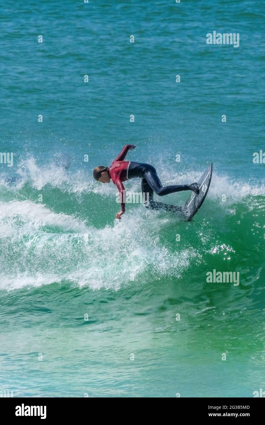 Spectacular surfing action as a surfer rides a wave at Fistral in ...