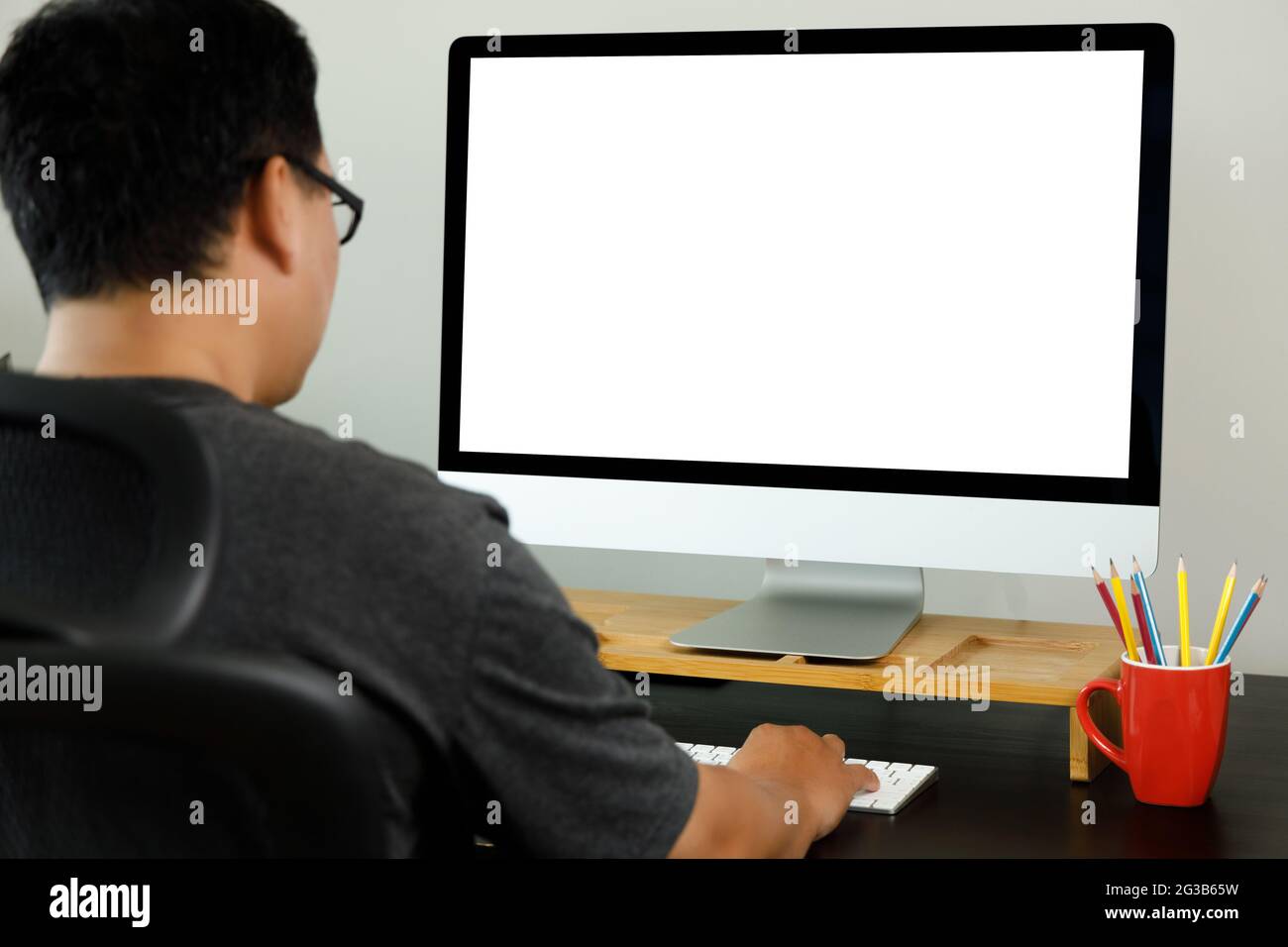 young man working Businessman using a desktop computer of the blank ...