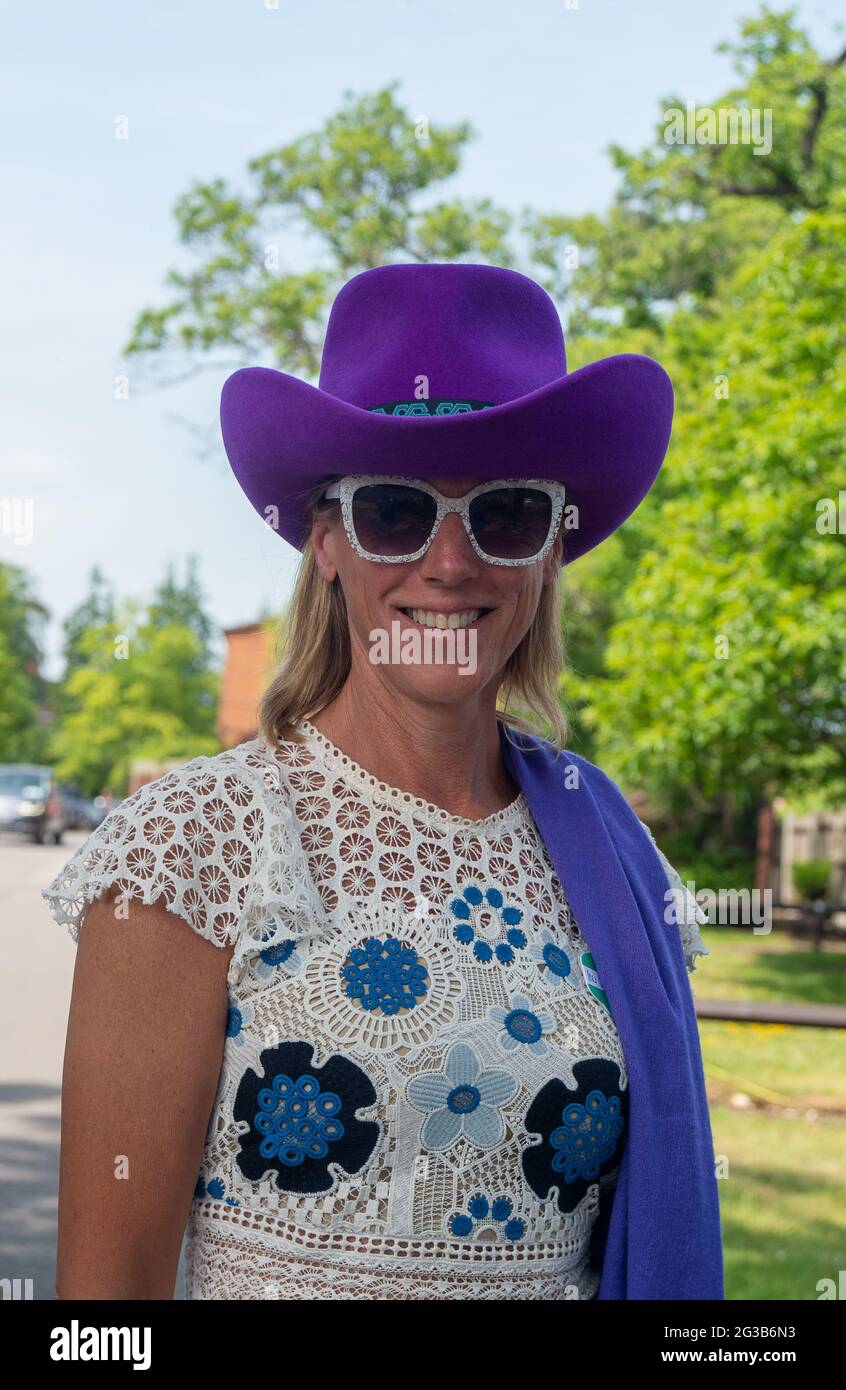 Ascot, Berkshire, UK. 15th June, 2021. A lady wears a purple cowboy hat ...