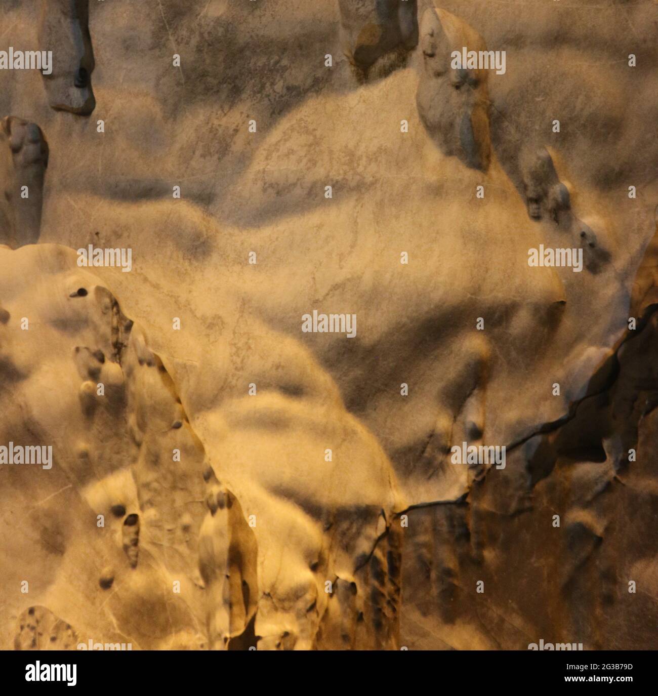 Gnomes or trolls on cream white cave wall Stock Photo - Alamy