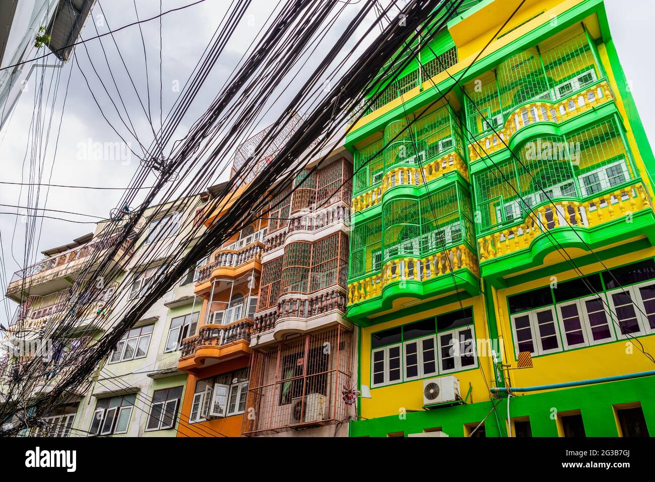 Colorful painted buildings in urban coveredy by disorganized black ...