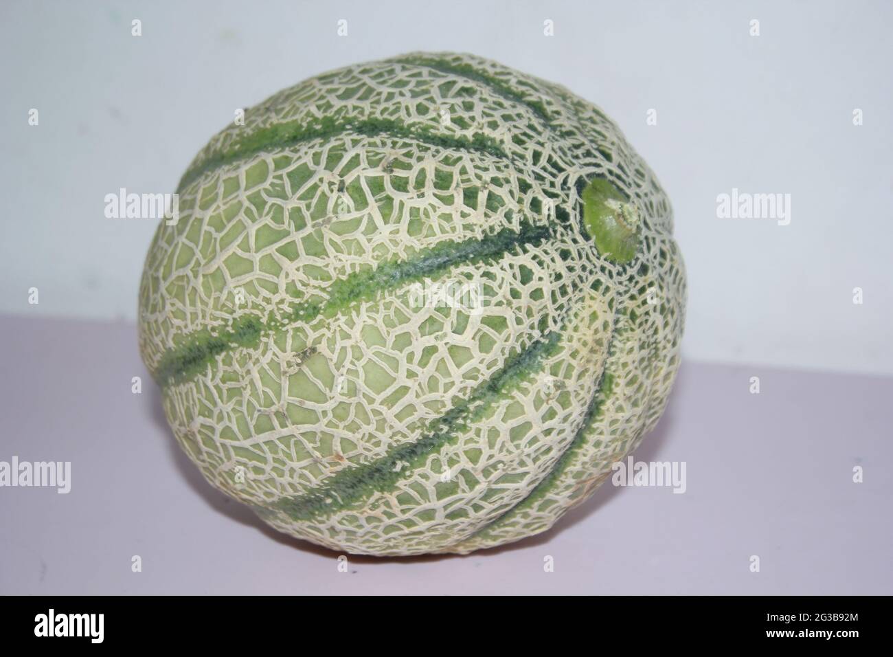 Close-up fresh melon picture on white background Stock Photo - Alamy