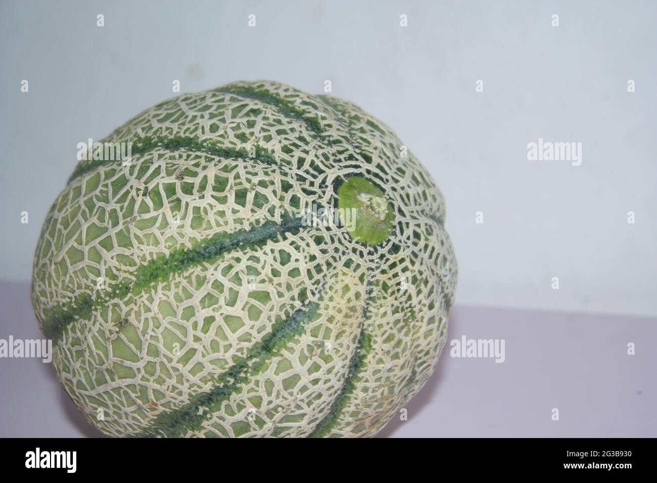 Close-up fresh melon picture on white background Stock Photo - Alamy
