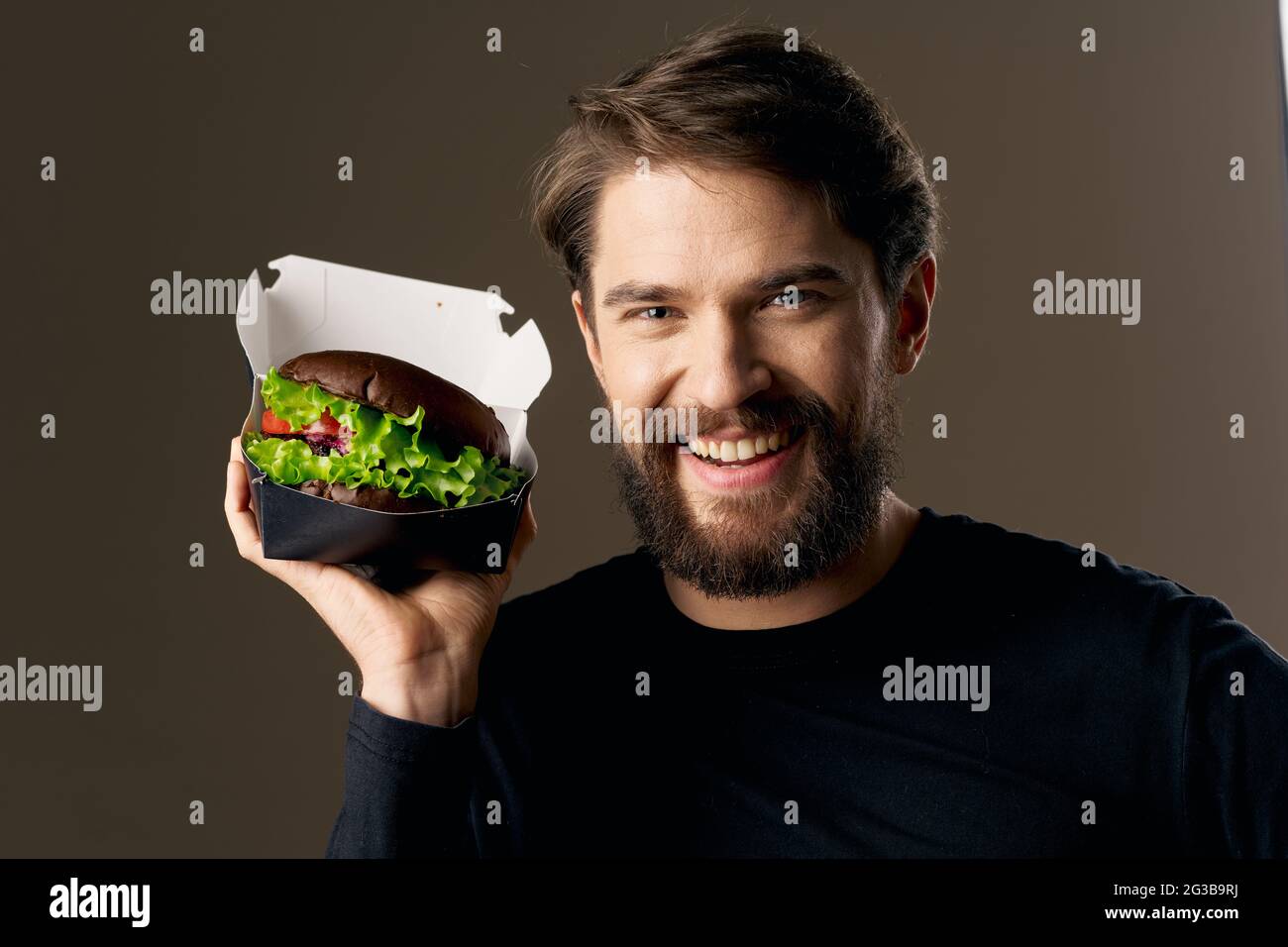 bearded man with hamburger fast food diet food gourmet restaurant Stock ...