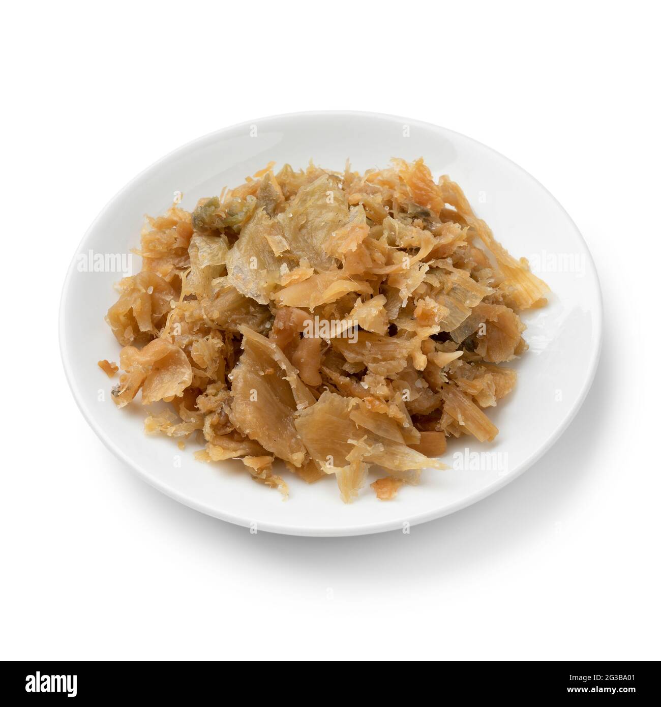 Traditional Chinese fermented cabbage on a ceramic plate close up ...