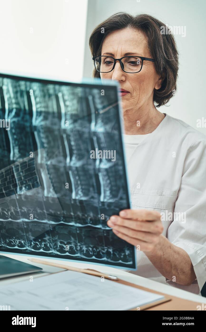 Experienced doctor reading MRI scans of the lumbar spine Stock Photo ...