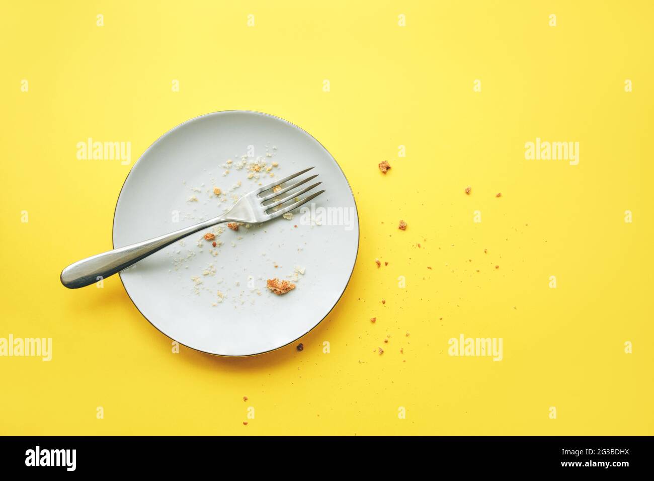 Conceptual image of the end of the holiday. Empty round plate with ...