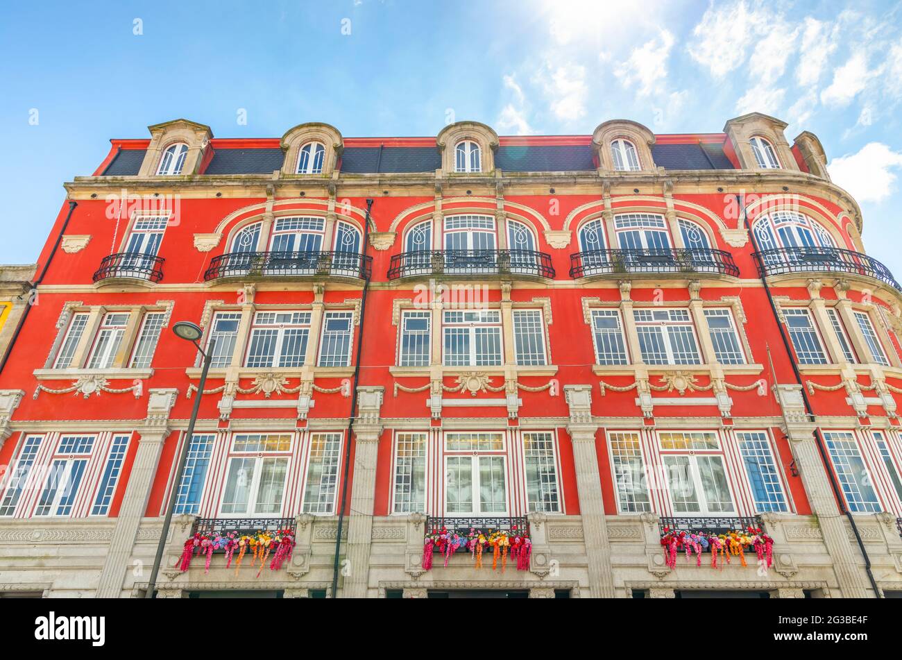 Beautiful urban house in vibrant orange color in downtown of Porto ...