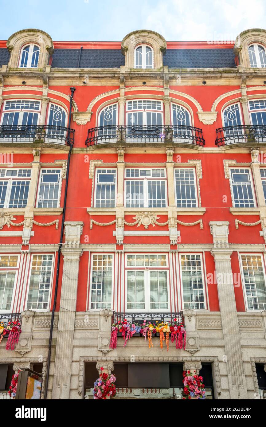 Beautiful urban house in vibrant orange color in downtown of Porto ...