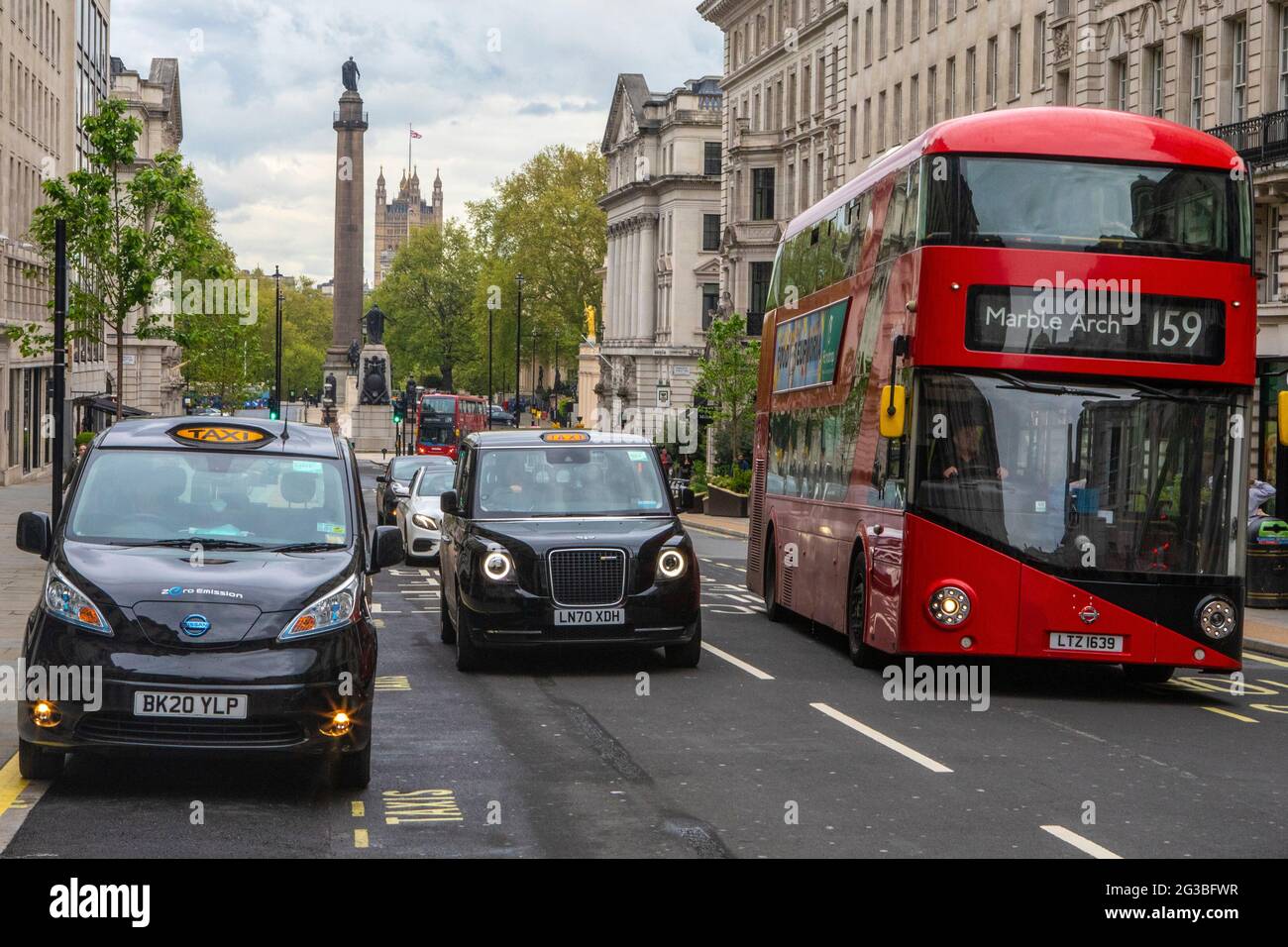 London, UK - May 13th 2021: London taxis, also known as black cabs, and ...