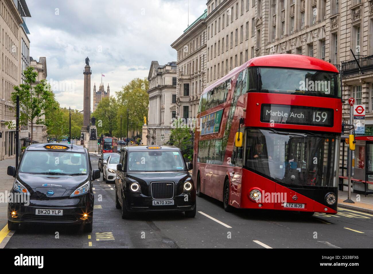 London, UK - May 13th 2021: London taxis, also known as black cabs, and ...