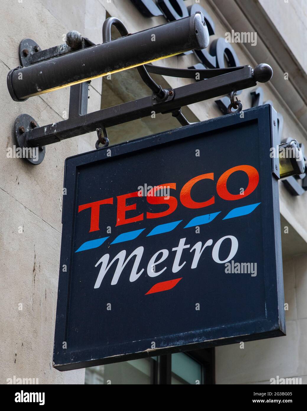 London, UK - May 13th 2021: Close-up of the Tesco Metro logo, above the ...
