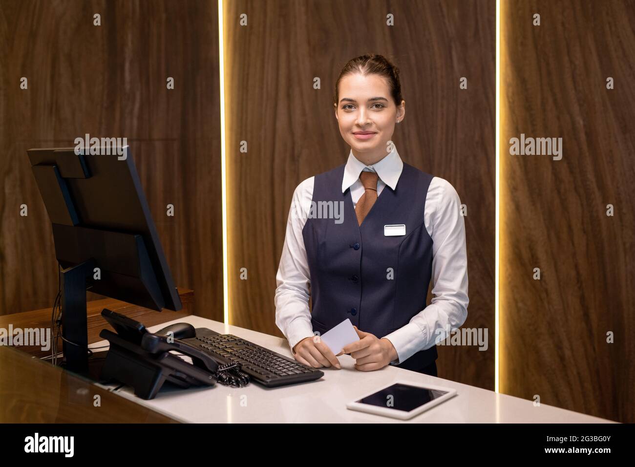 Young receptionist hi-res stock photography and images - Alamy