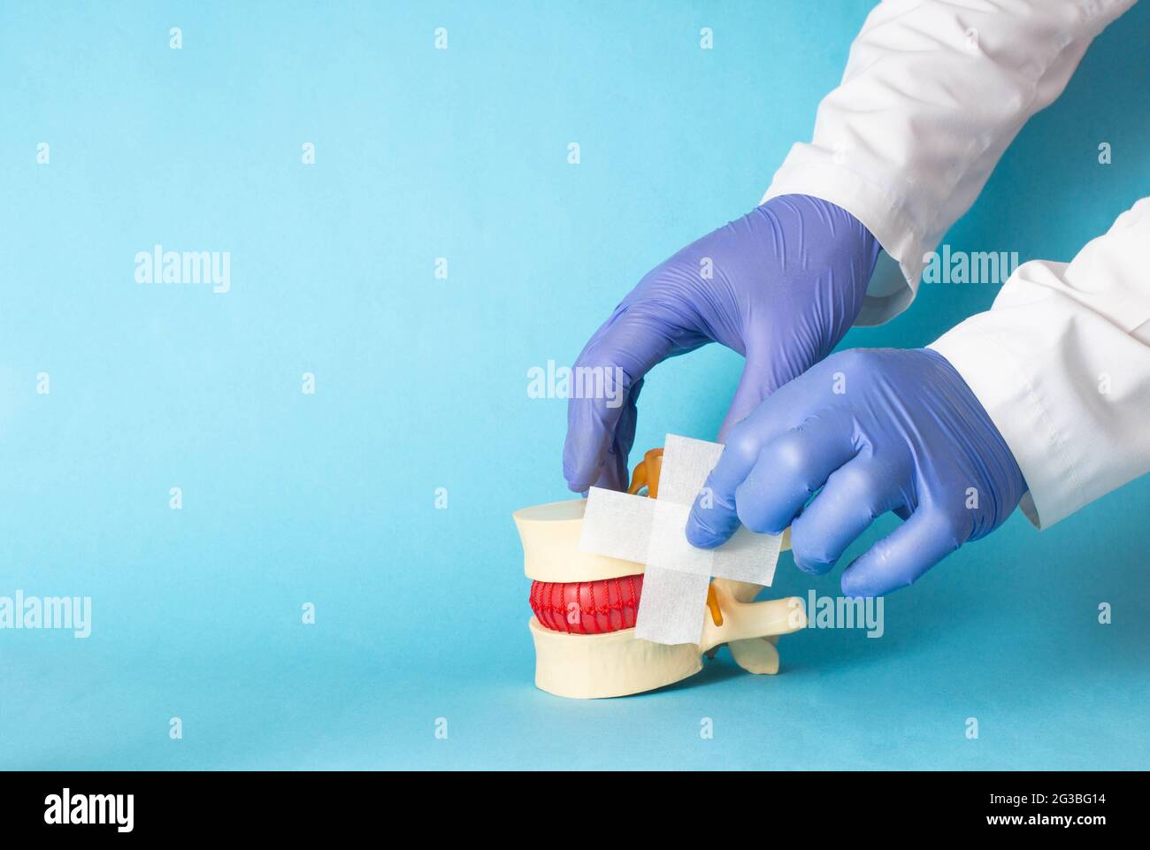 Doctor's hands glue a medical plaster on the mockup of the ...