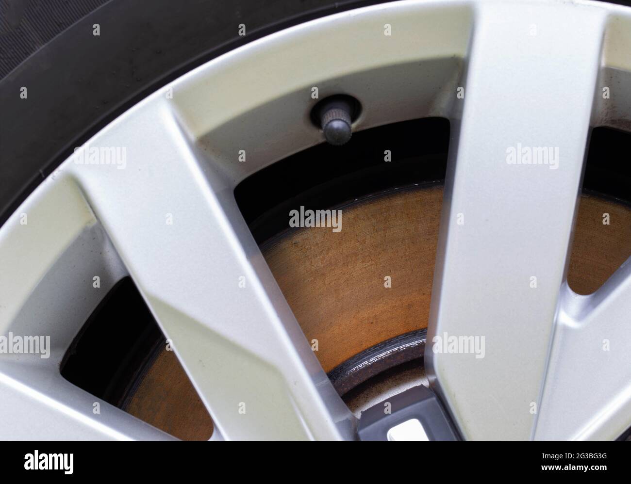 Rusty, defective brake disc with a shoulder on the edge. Worn brake ...