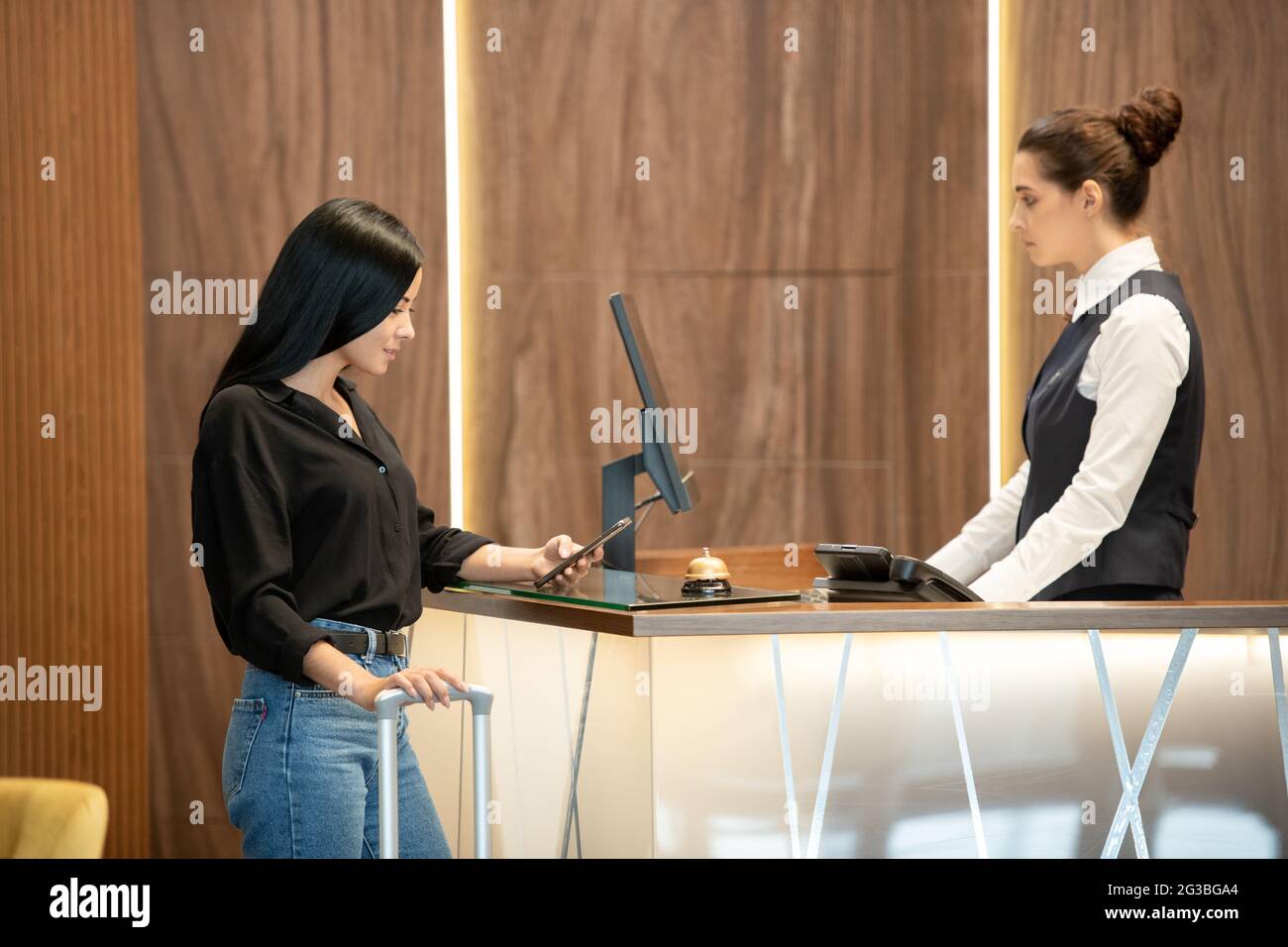 Businessman woman sitting reception desk hi-res stock photography and ...
