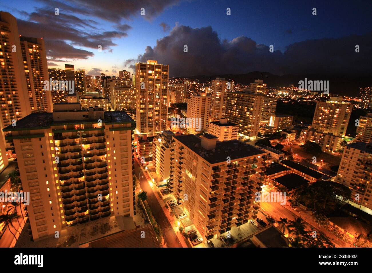 city lights and sunset in honolulu hawaii from the alohilani resort ...