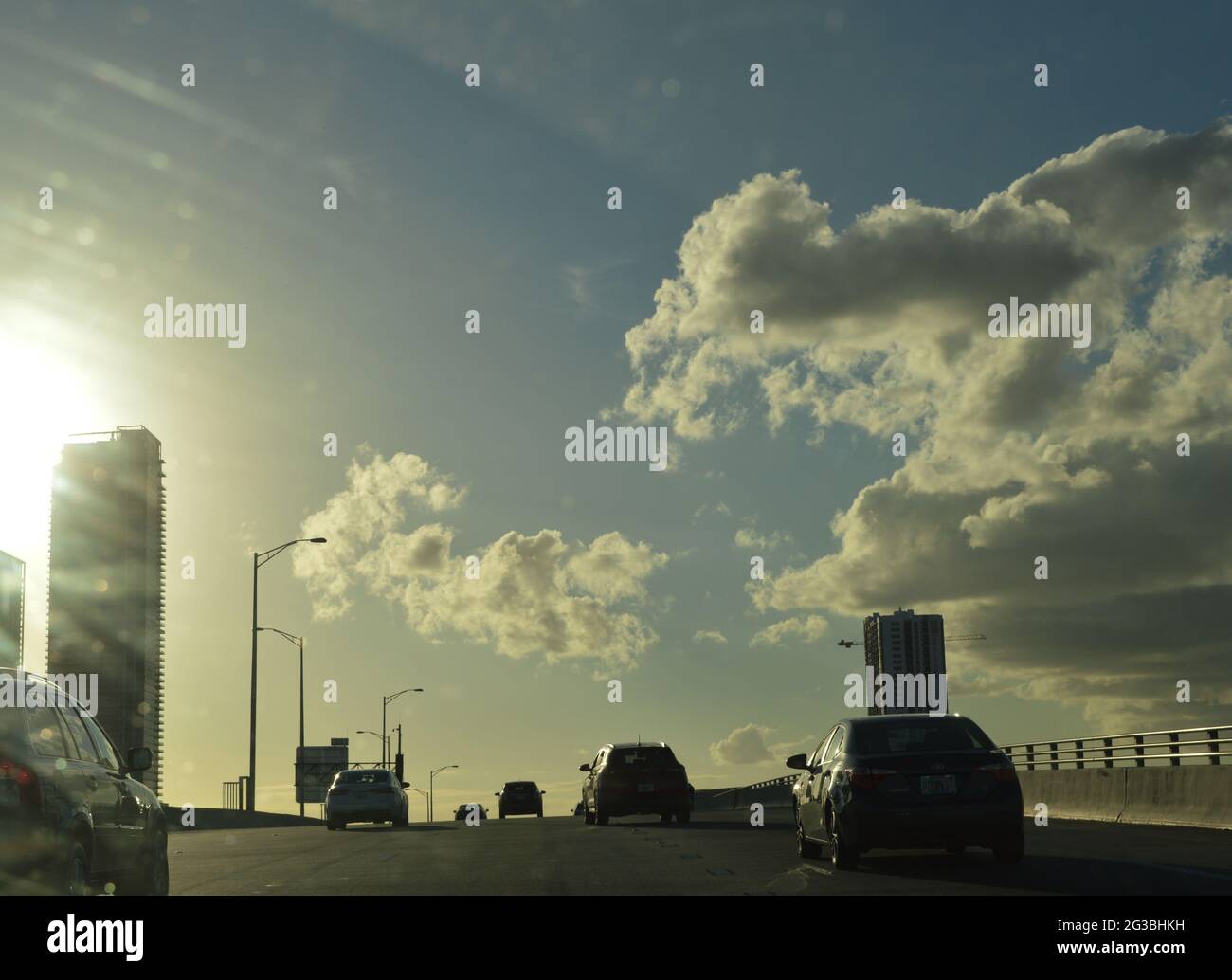 Cars crossing a bridge in Miami during late afternoon hour Stock Photo ...