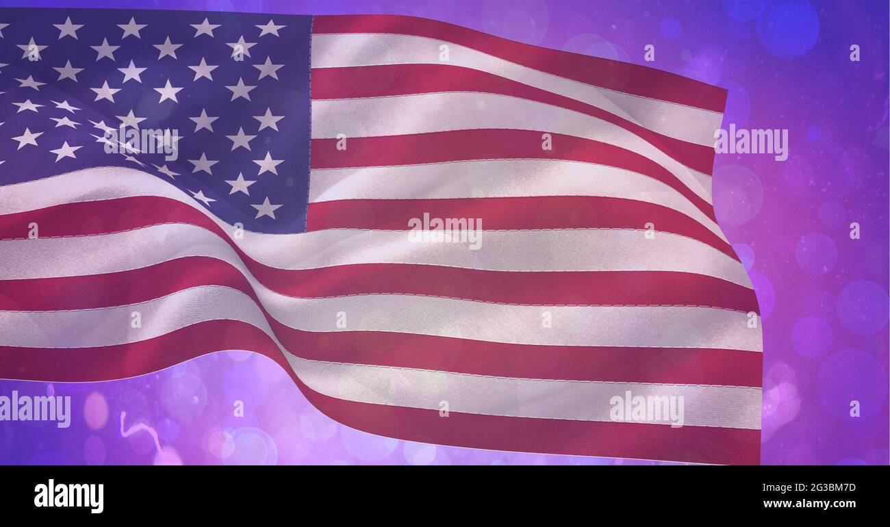 Composition of billowing american flag over defocussed purple lights ...