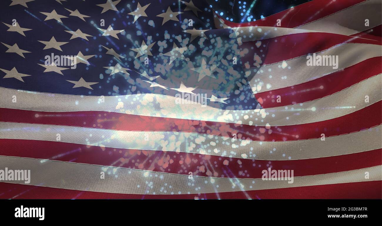 Composition of billowing american flag over fireworks in night sky ...