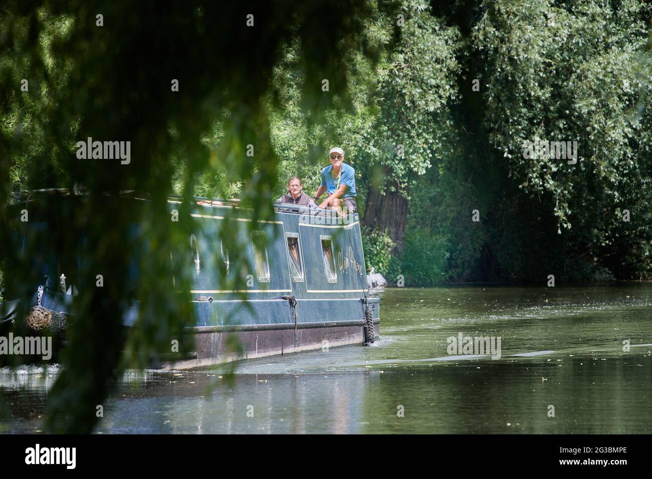 Cruise along the river Nene, England, in a canal boat on a summer day ...