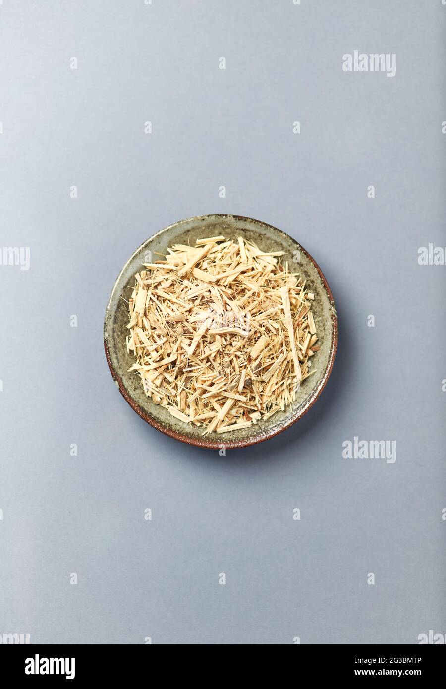 Dry Siberian ginseng (Eleutherococcus senticosus) on paper background ...