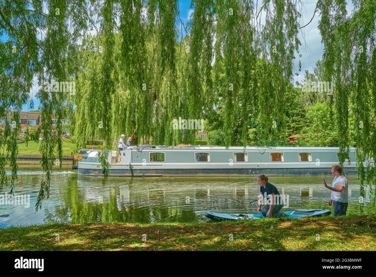 Cruise along the river Nene, England, in a canal boat on a summer day ...