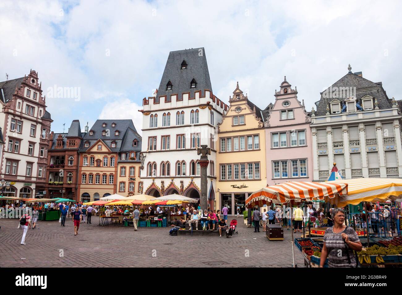 TRIER, GERMANY- AUGUST 3: People and stalls at Market square in Trier ...