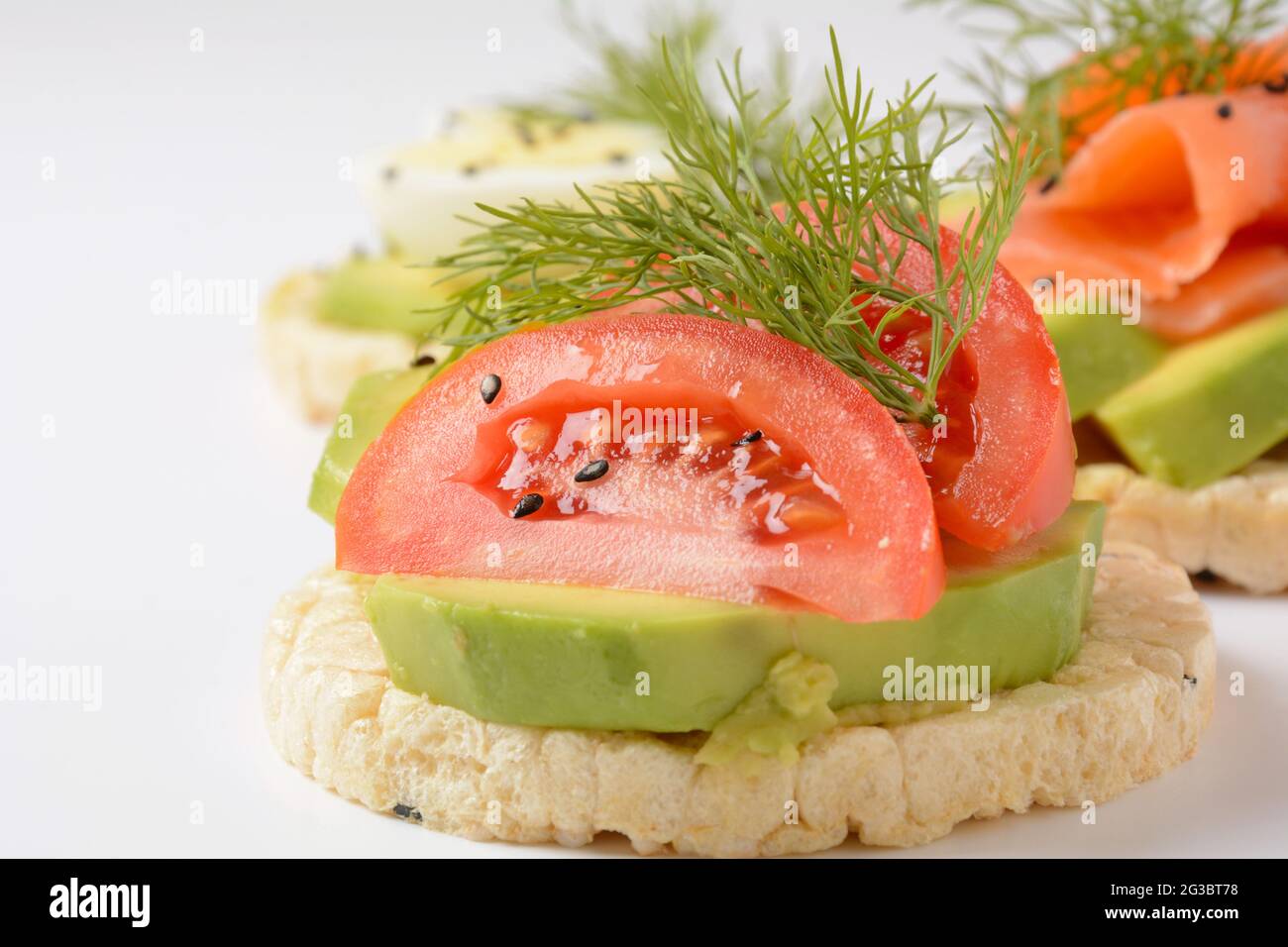 Rice bread Crispy bred, avocado, tomatoes and fresh dill Stock Photo ...