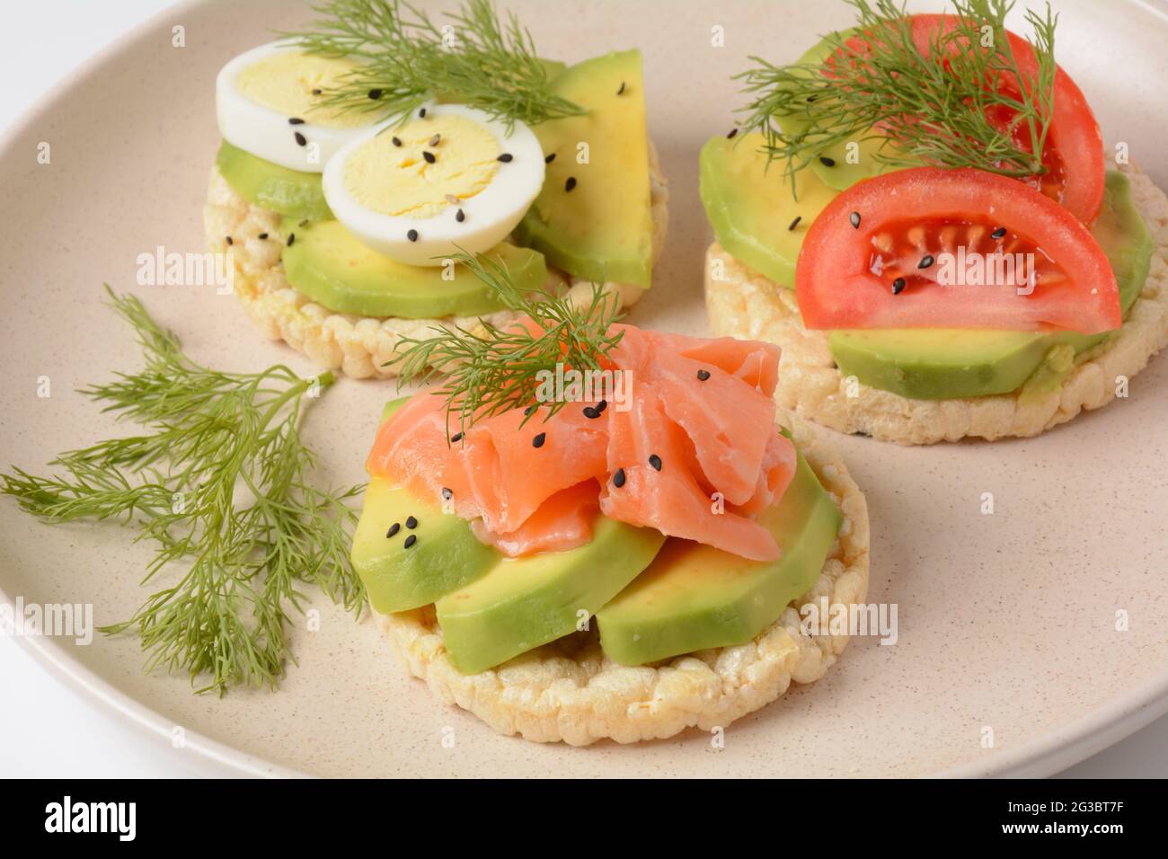 Rice bread Crispy bred, avocado, boiled eggs slices , salmon, tomatoes ...