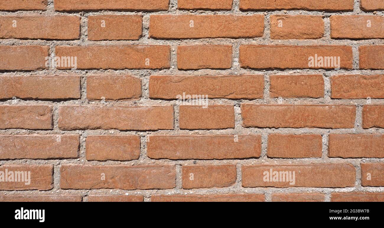 wide 4K red brick wall useful as a background Stock Photo - Alamy