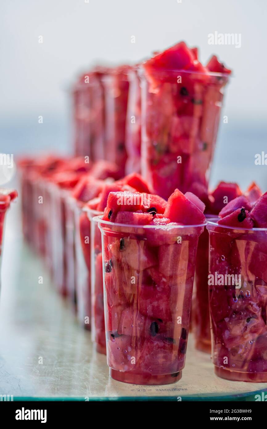Closeup shot of plastic cups full of watermelon pieces Stock Photo - Alamy