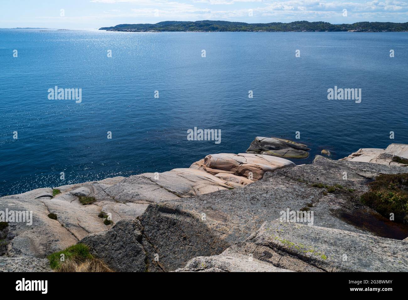 the beautiful coast of norway with its rock formations and blue water ...