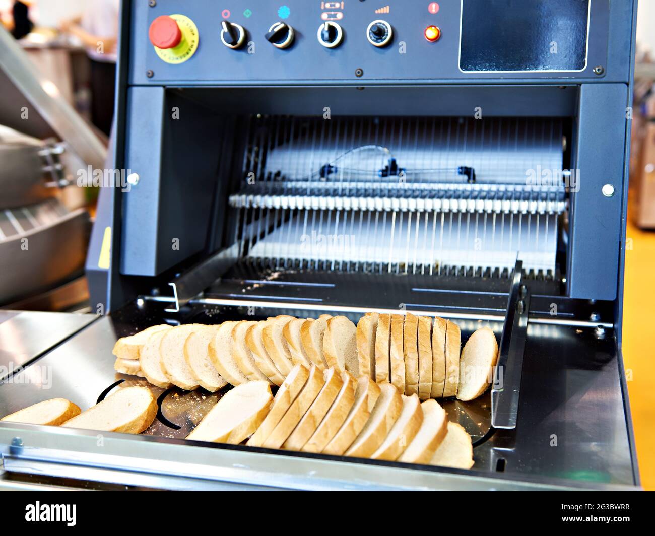 Sliced white bread in a cutting machine Stock Photo - Alamy