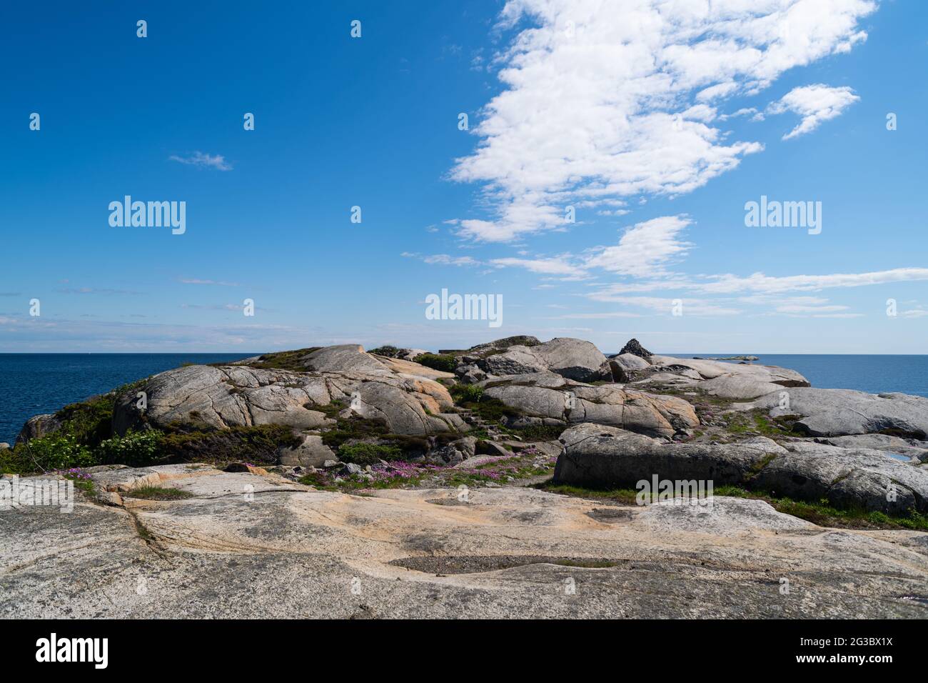the beautiful coast of norway with its rock formations and blue water ...