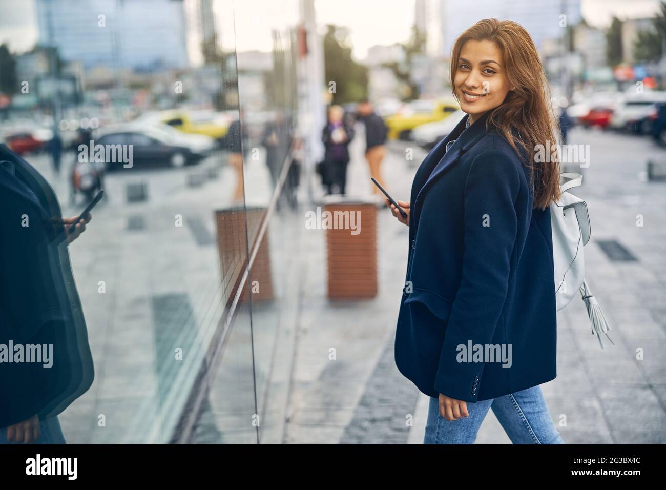 Pretty beautiful woman laughing and waving hand in camera Stock Photo ...
