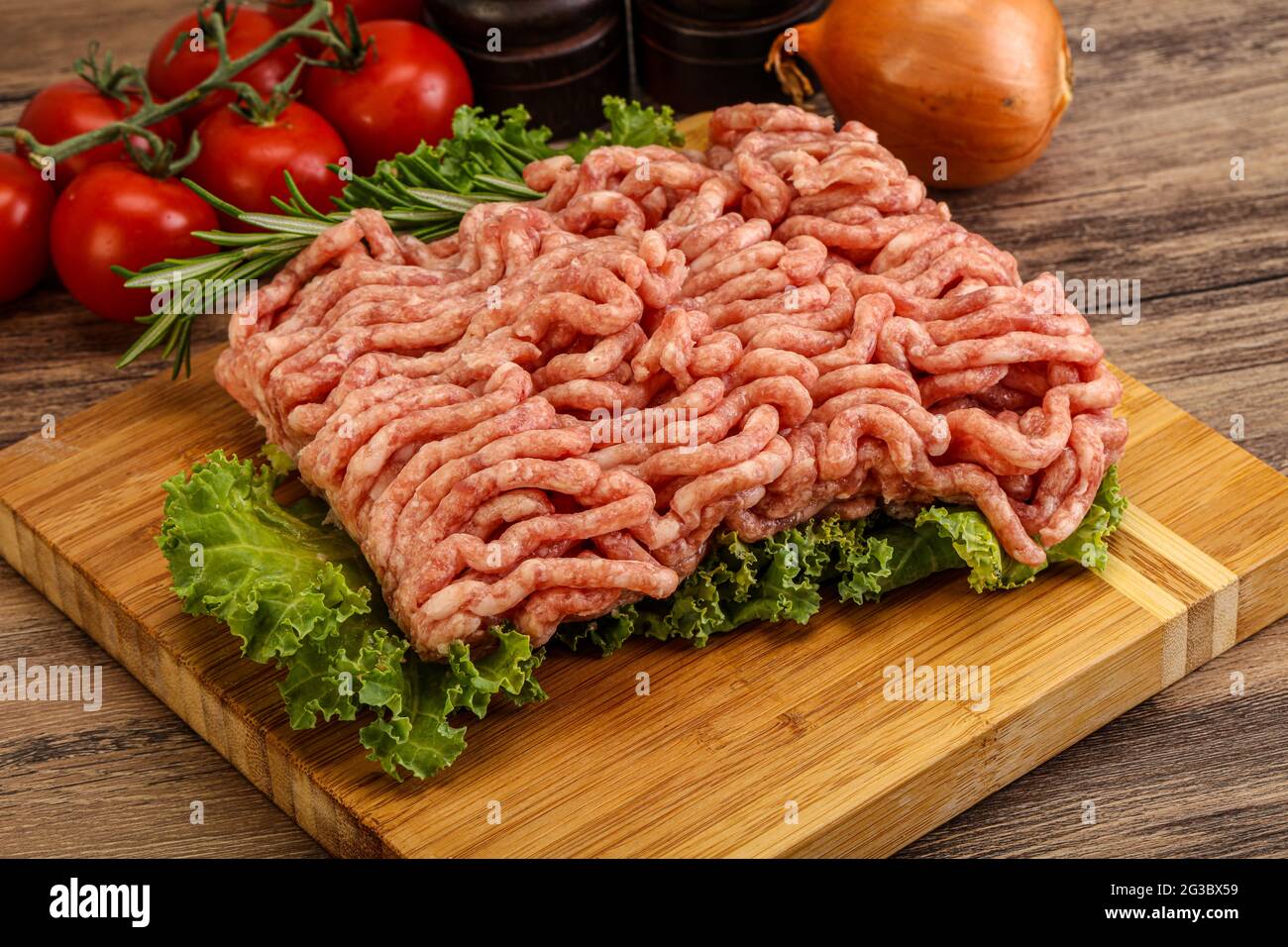 Raw pork minced meat over board for cooking Stock Photo - Alamy