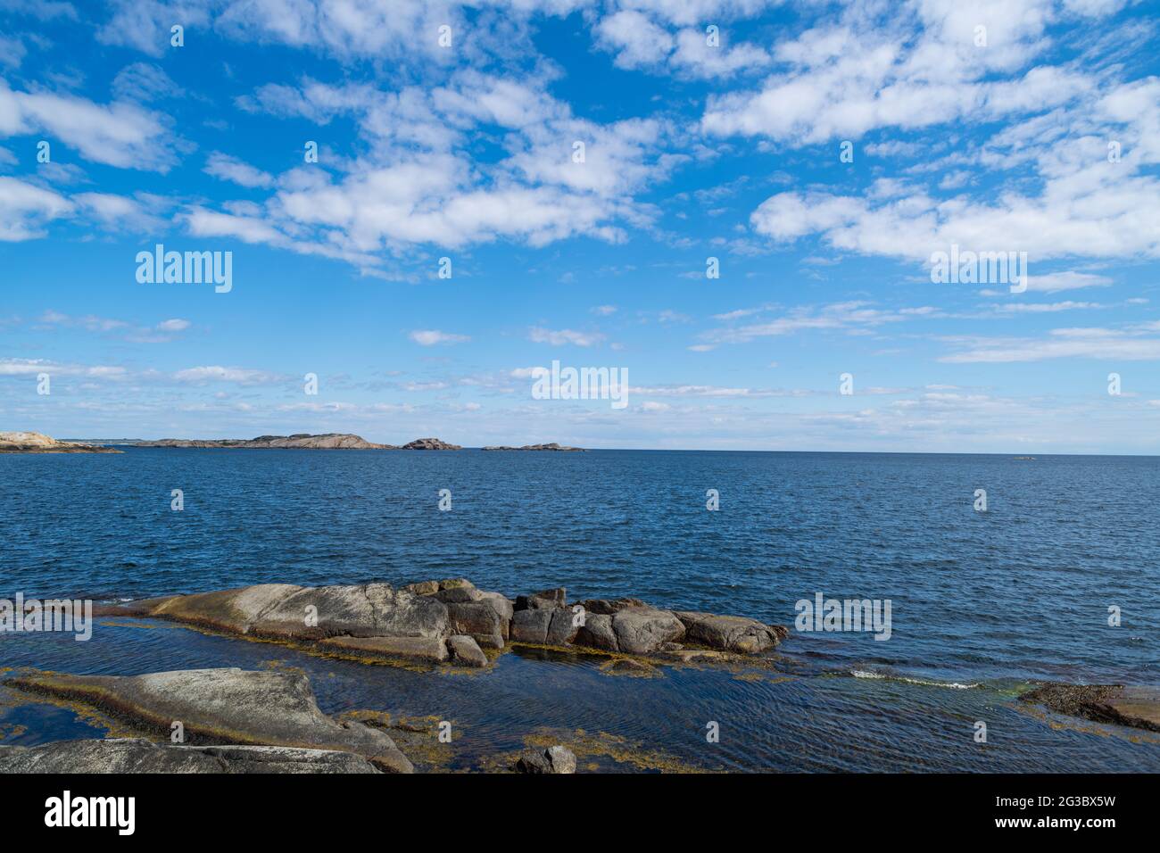 the beautiful coast of norway with its rock formations and blue water ...