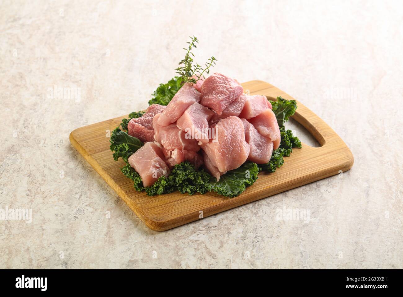 Raw pork meat cubes for coocking over board Stock Photo - Alamy