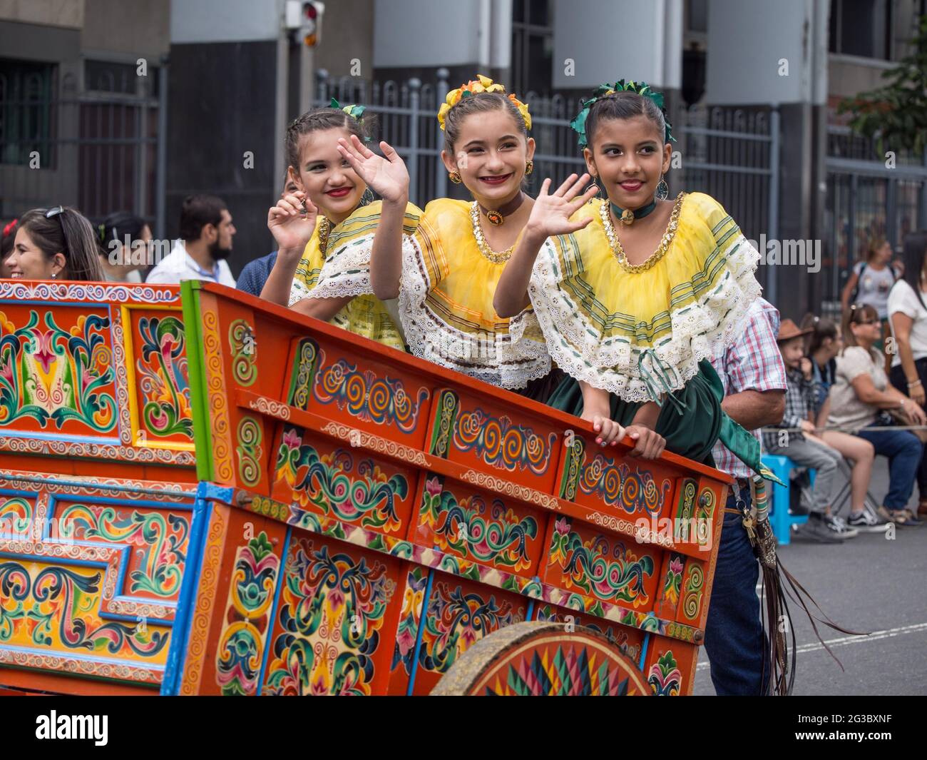 Young girls in traditional dress in the Ox cart parade in San José ...