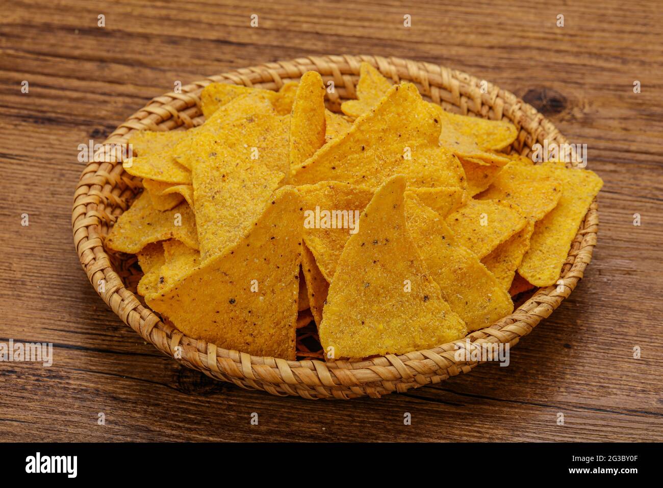 Mexican crunchy corn nachos triangle heap Stock Photo - Alamy